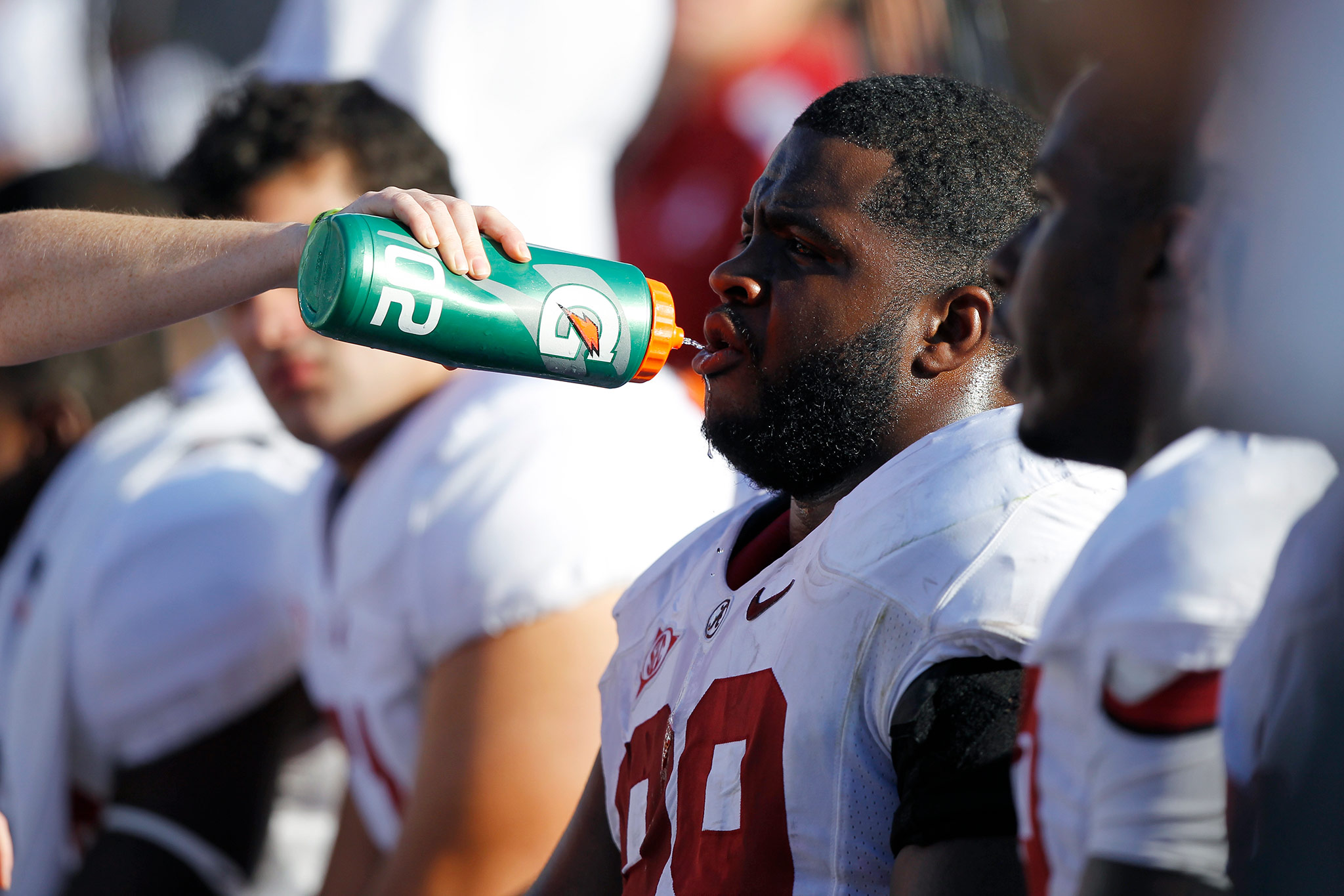 Football Players Drinking Gatorade